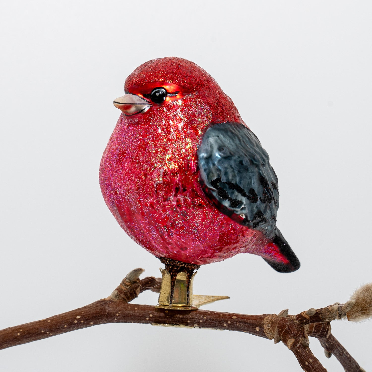 Rød/sort fugl på klips